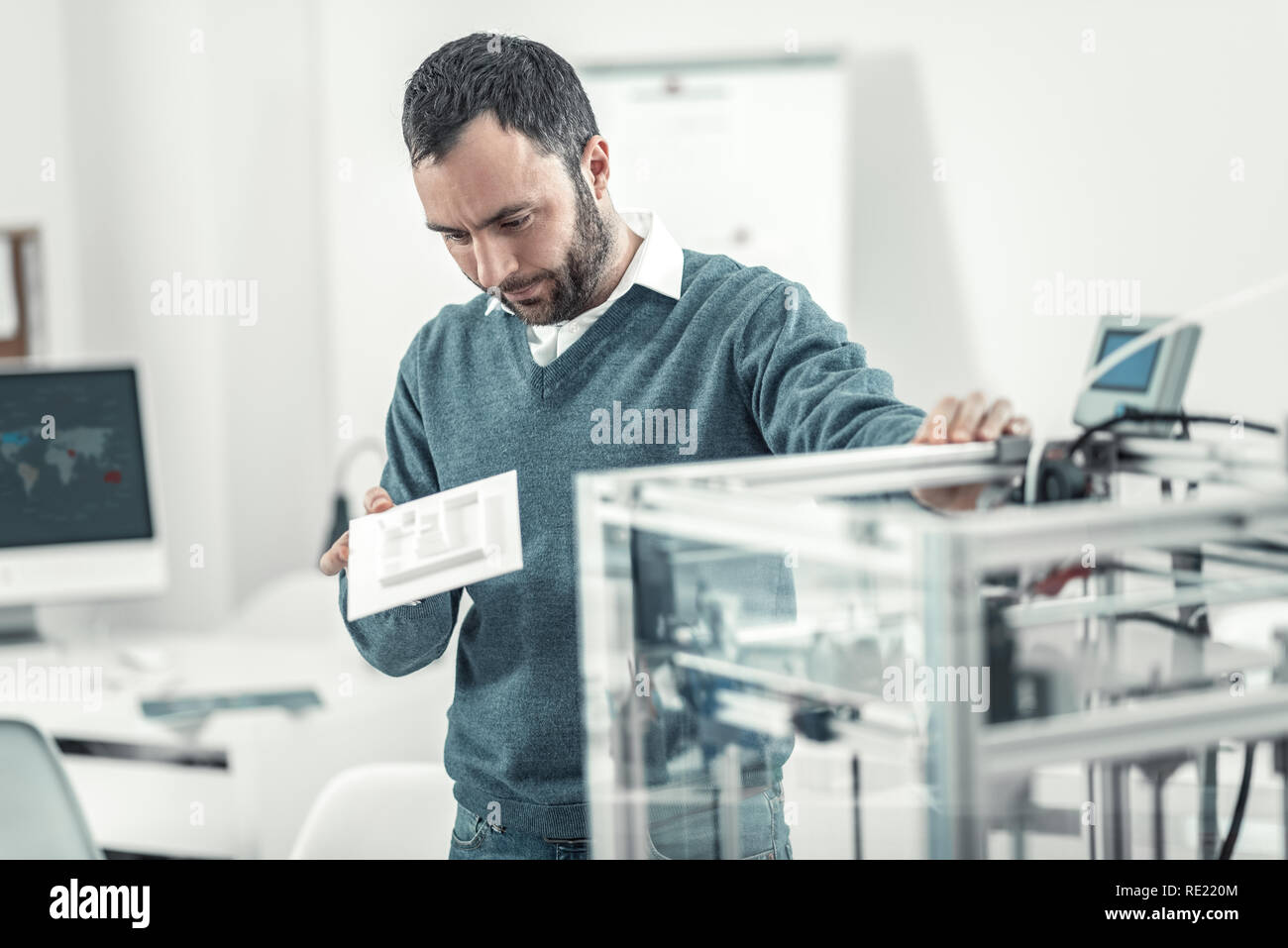 Smart serious adult man reading the instruction Stock Photo - Alamy