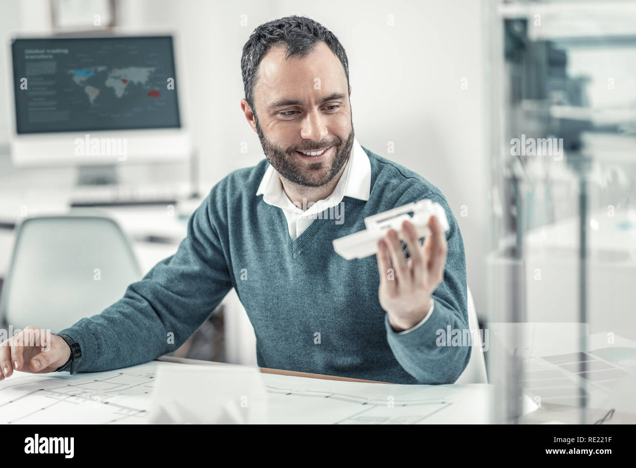 Joyful positive adult man smiling at work Stock Photo - Alamy Joyful positive adult man smiling at work Stock Photo - Alamy