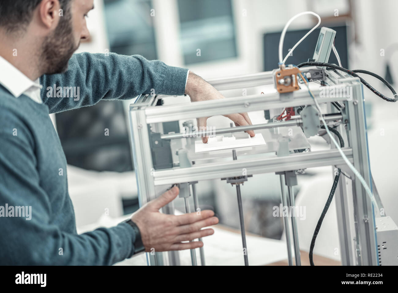 Nice smart man making a 3d model Stock Photo - Alamy