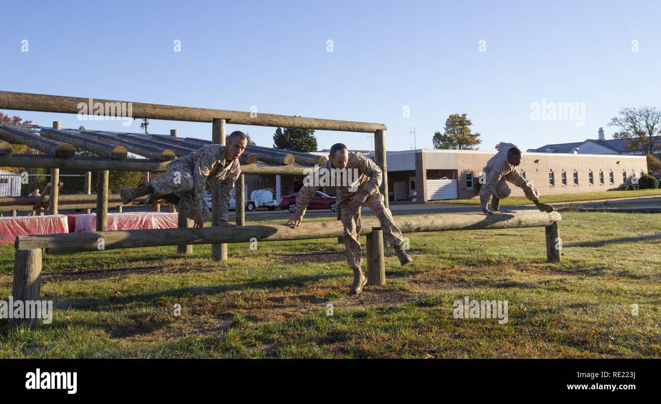 U.S. Marine candidates with Officer Candidate School (OCS) hurdle over ...