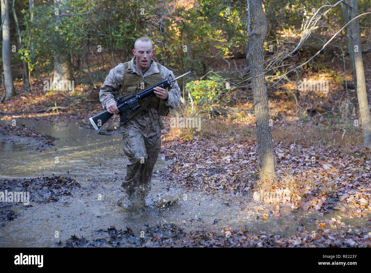 A U.S. Marine candidate with Officer Candidate School (OCS) runs ...