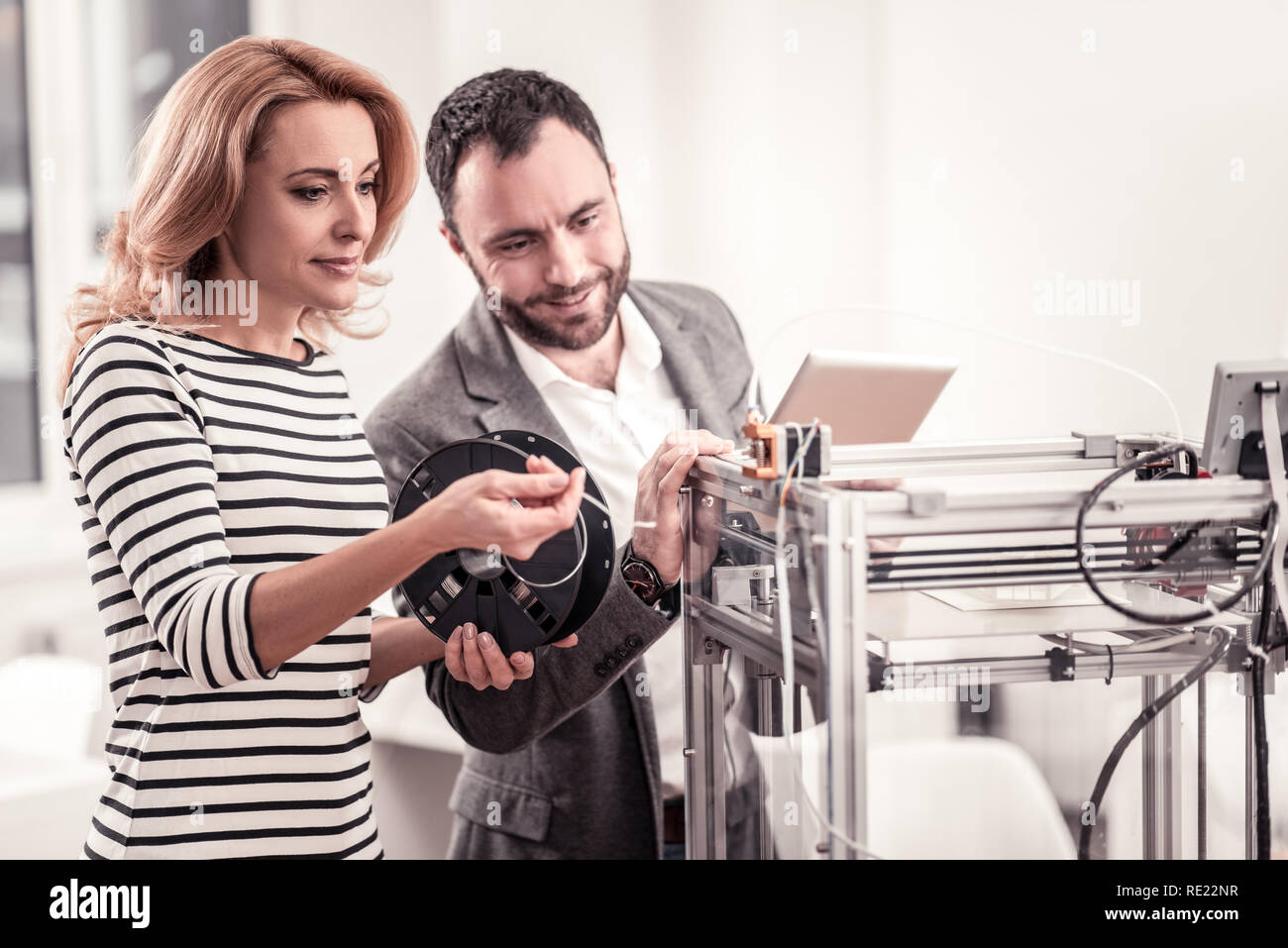 Creative designers learning printing models on 3D printer Stock Photo ...