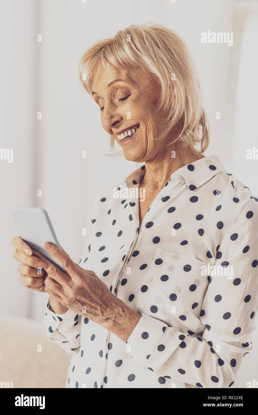Cheerful woman being high spirited Stock Photo - Alamy