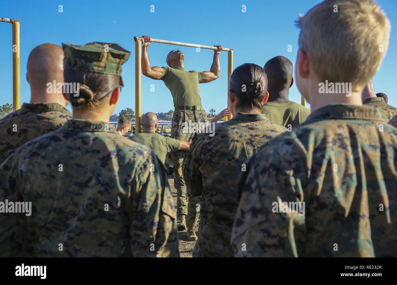 A Marine of Headquarters and Service Battalion executes pull-ups during ...