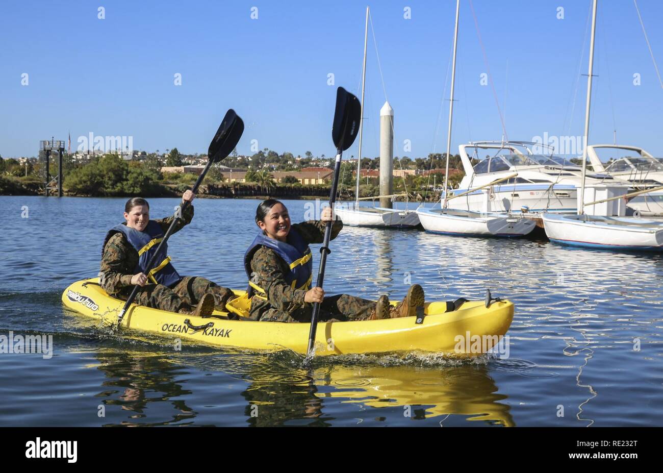 Marines of Headquarters and Service Battalion compete in a kayak race ...