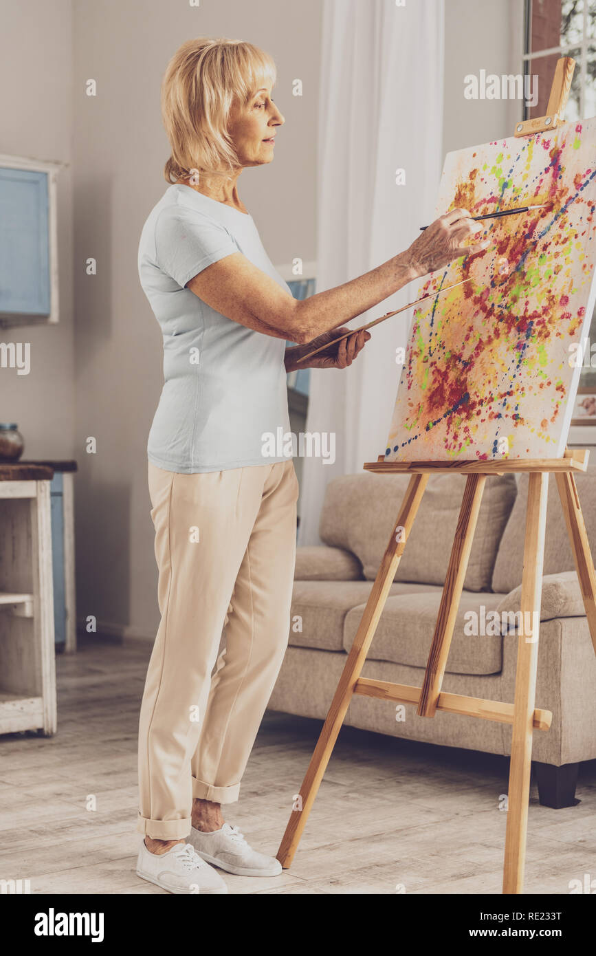 Concentrated female person drawing abstraction Stock Photo - Alamy