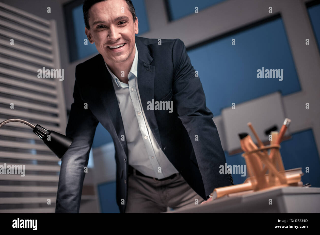 Happy positive nice man being at work Stock Photo - Alamy