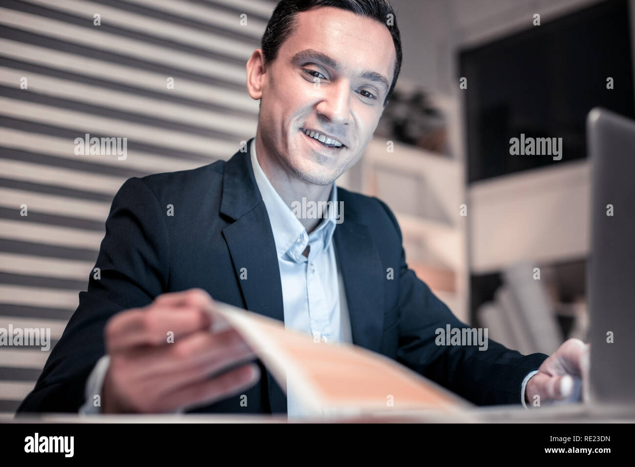Cheerful positive smart man being at work Stock Photo - Alamy