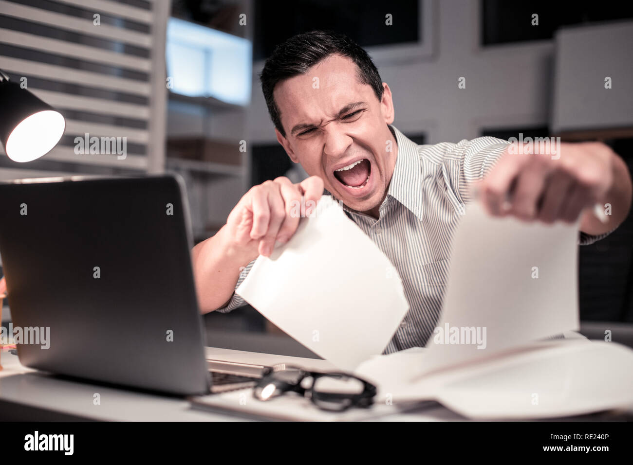 Angry cheerless adult man expressing his emotions Stock Photo - Alamy