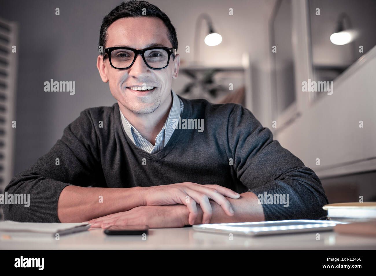 Smart guy sitting workplace hi-res stock photography and images - Alamy