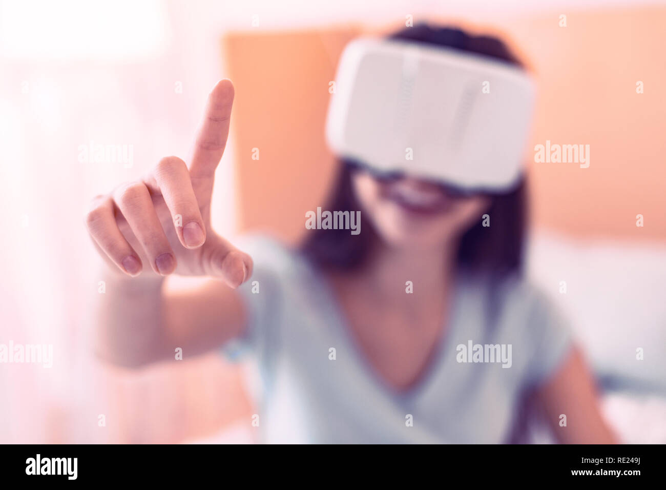 View of girls hand trying to touch something Stock Photo - Alamy