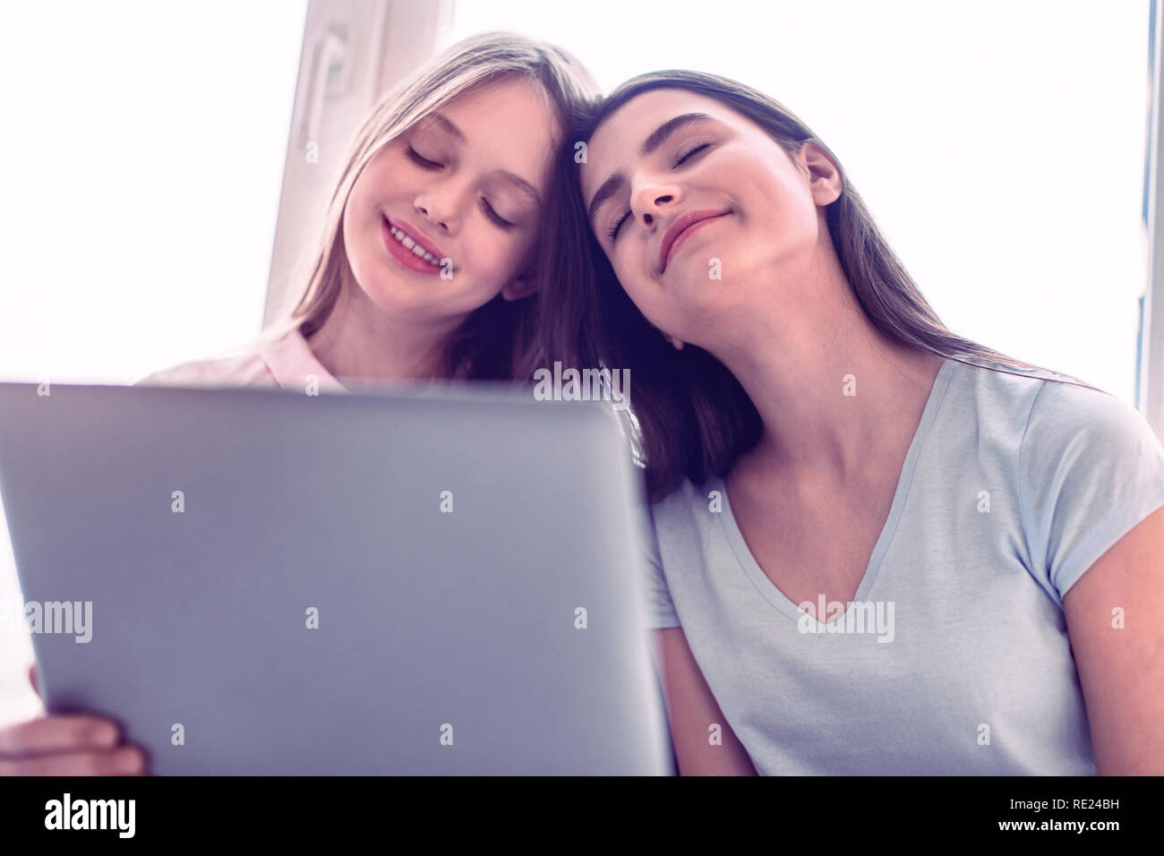 Pleasant girls spending time together on the weekend Stock Photo - Alamy