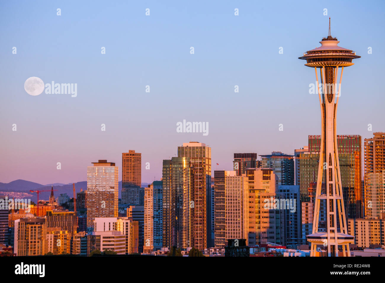 Seattle Skyline with Full Moon and Evening colors Stock Photo - Alamy
