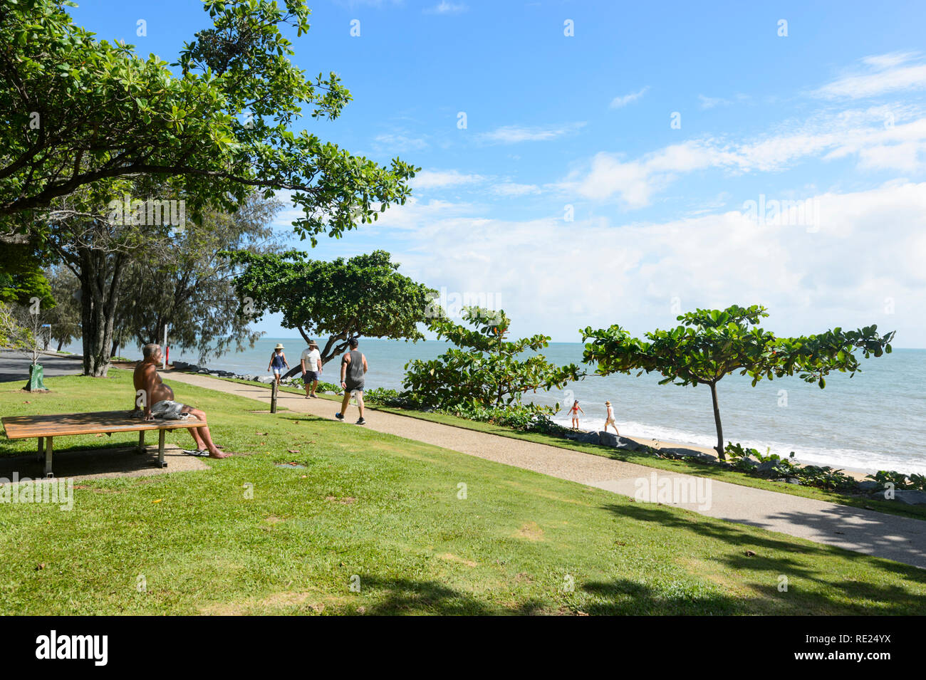 People relaxing on the Promenade, Trinity Beach, Cairns Northern ...