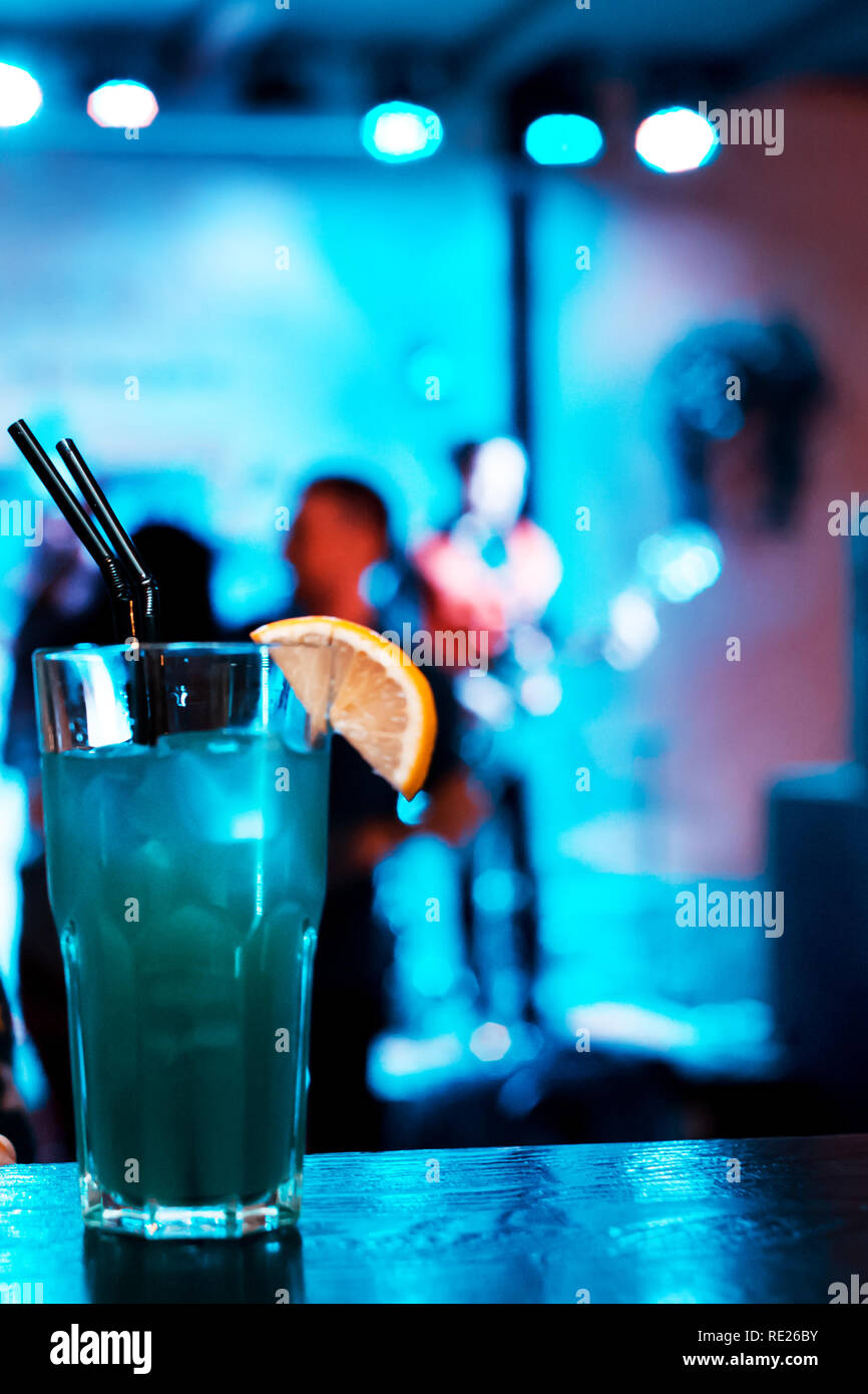 Glass of cocktail on bar background Stock Photo - Alamy
