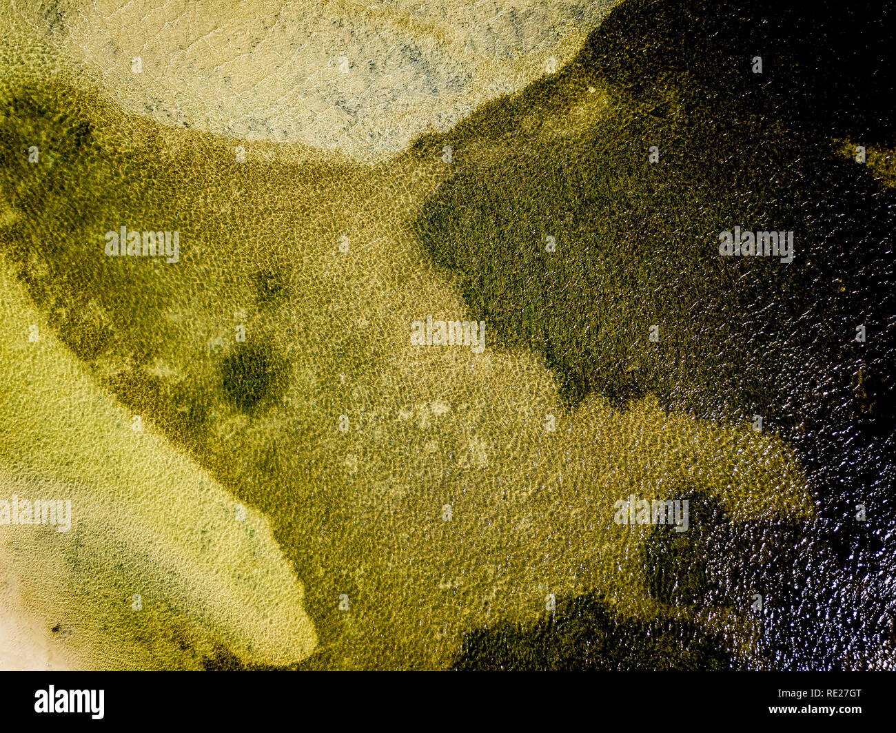 Patterns in the sand from clear green water from an aerial view Stock ...