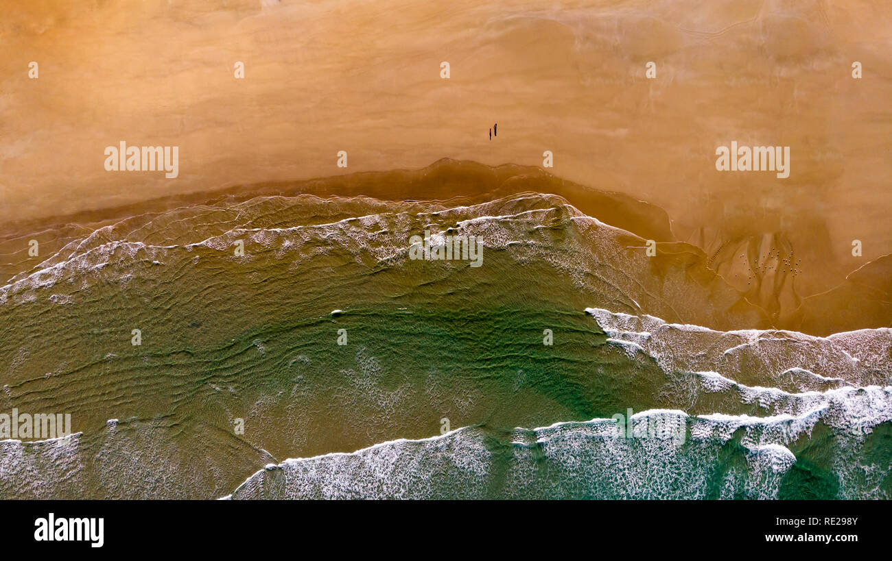 Beautiful aerial view of a beach with waves. Natural textures and ...