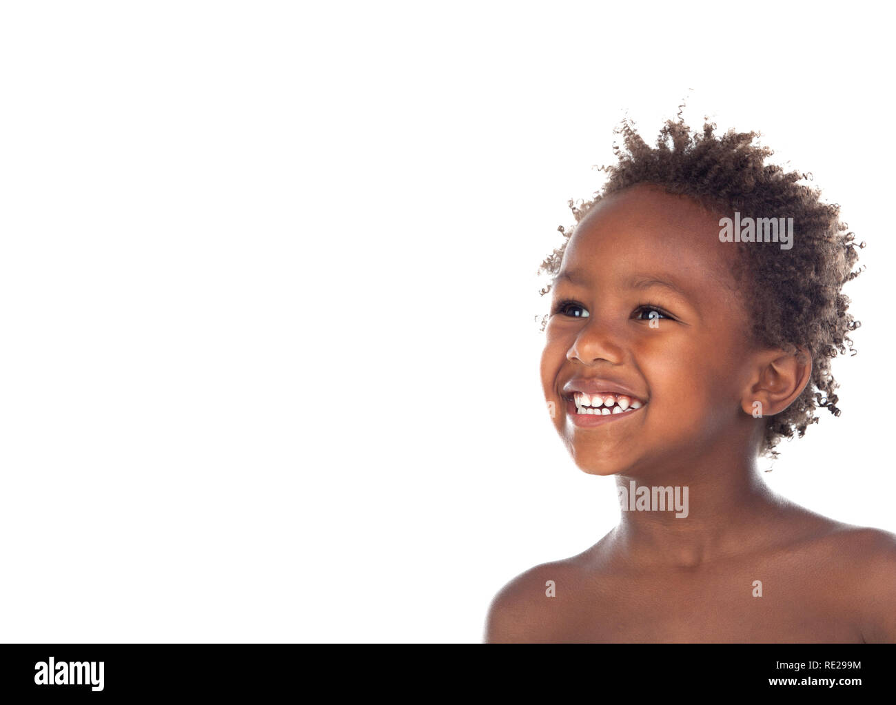 Adorable afroamerican child looking up isolated on a white background ...
