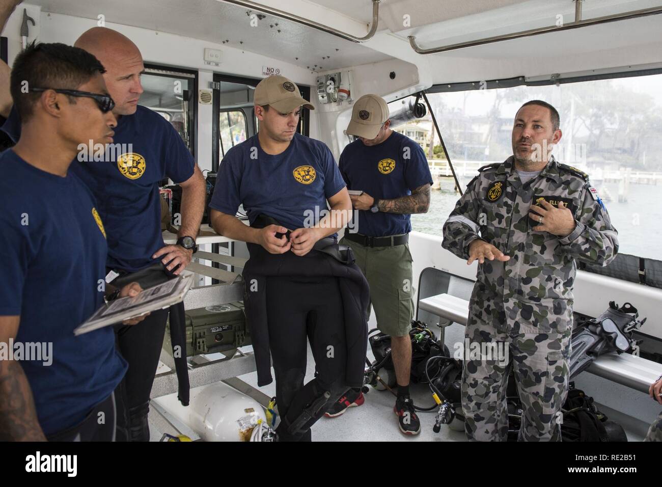 Navy Divers assigned to Mobile Diving Salvage Unit (MDSU) 1 and a Royal ...