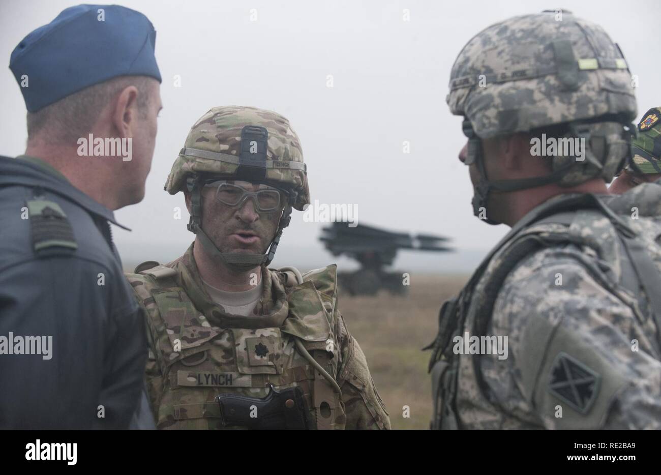 U.S. Army Lt. Col. Douglas Lynch (center), Commander of the 10th Army ...