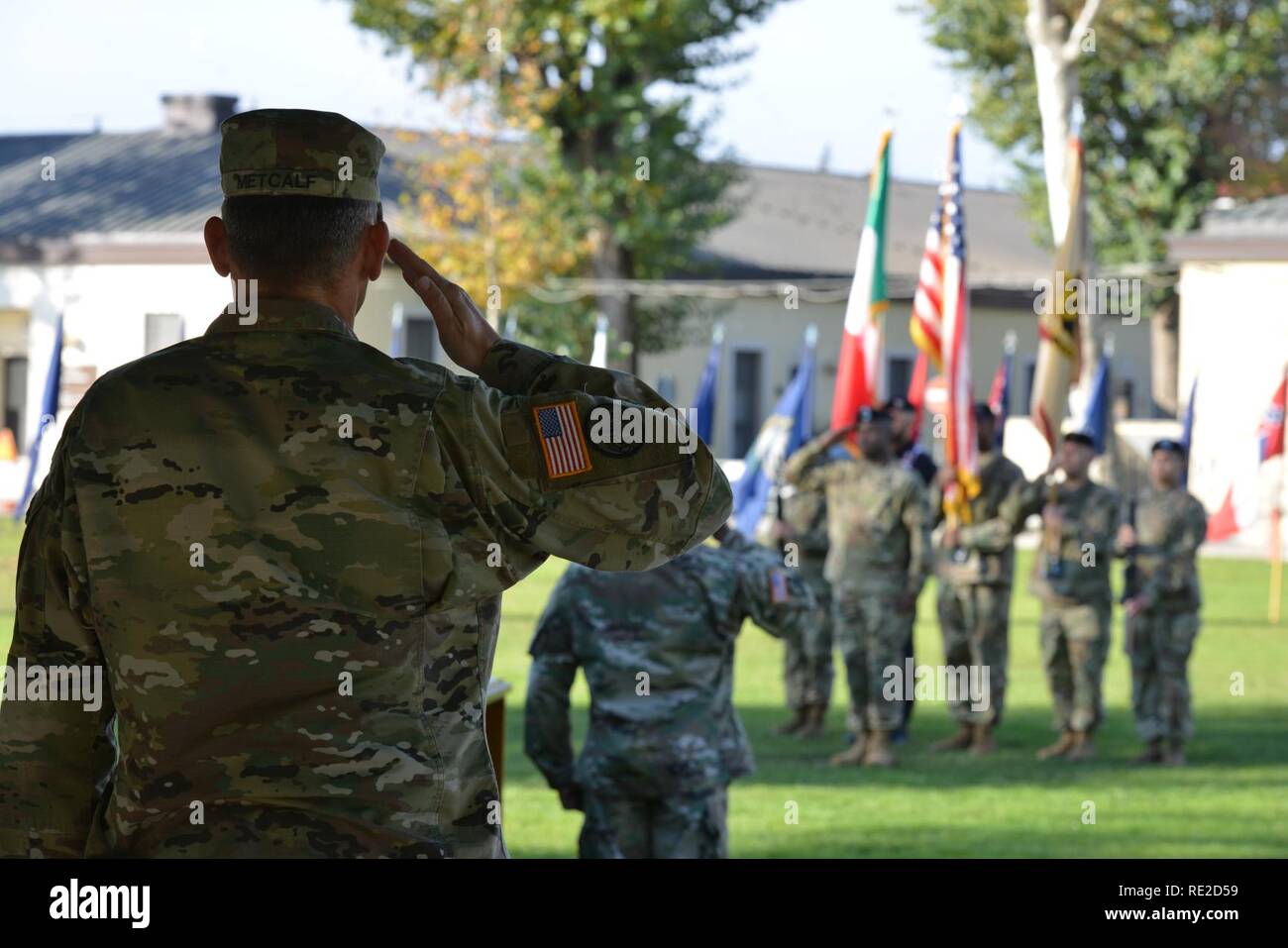 U.S. Soldiers assigned to the 414th Contracting Support Brigade salute ...