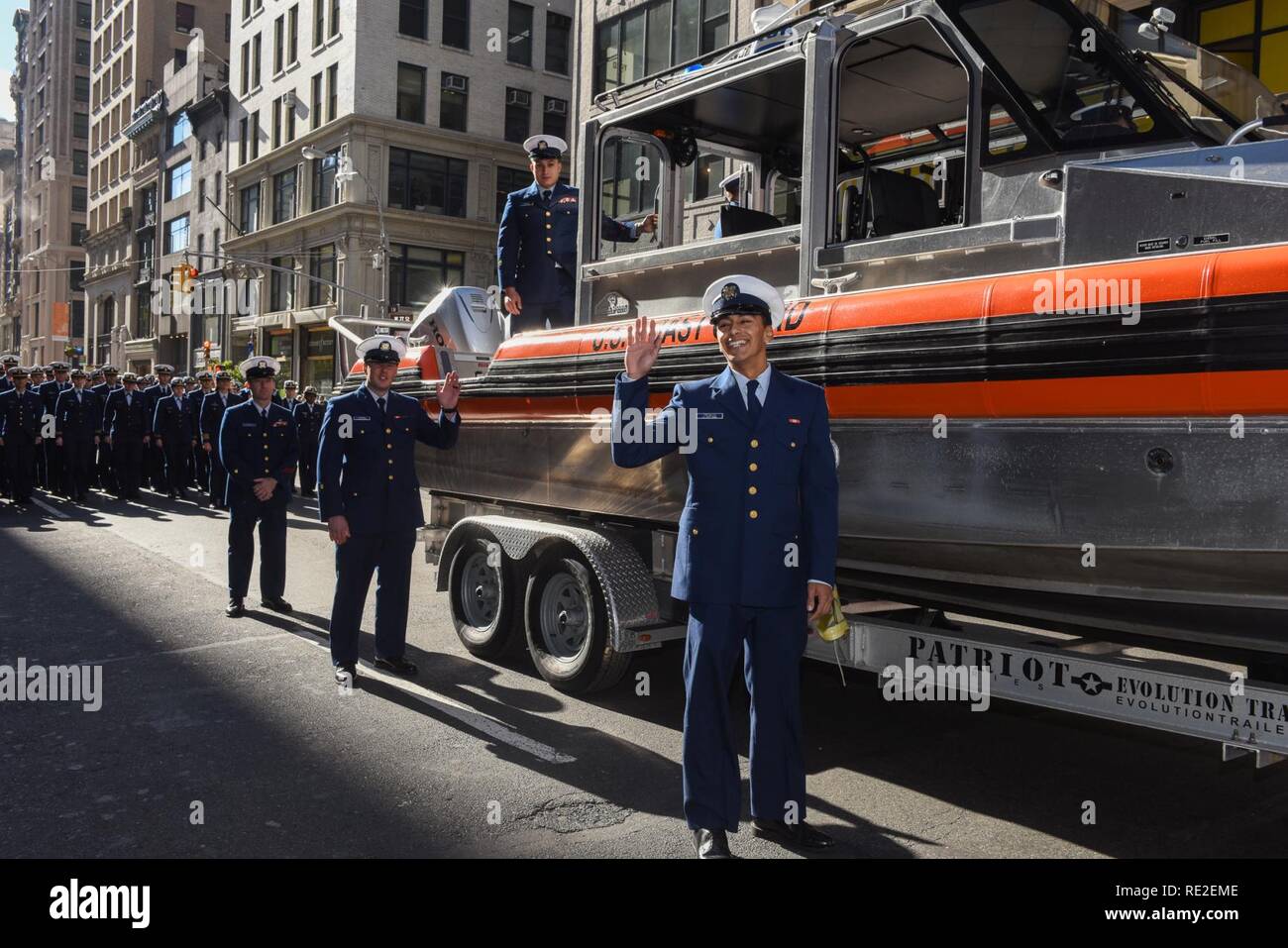 Coast Guard Station Kings Point crewmembers wave to the cheering crowds ...