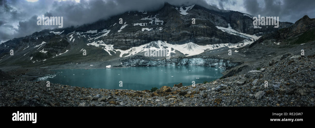 Alpine glacier lake in Swiss Alps - with water and ice in cold blue ...