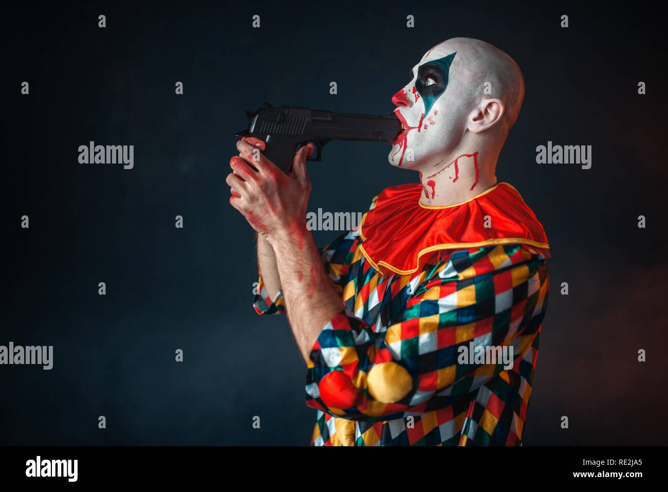 Evil mask man gun hi-res stock photography and images - Alamy