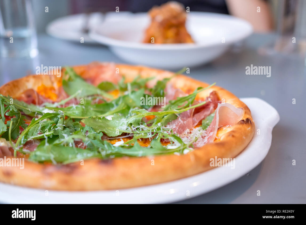Homemade ham rocket cheese tomato sauce pizza hi-res stock photography ...