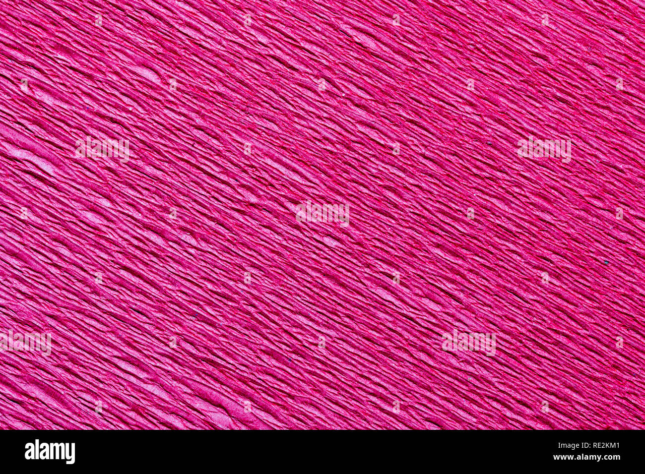 An abstract textured background created with colorful red crepe paper ...