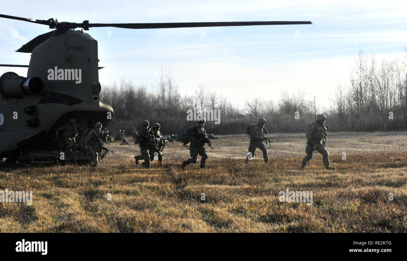 Soldiers from 1st Brigade Combat Team, 10th Mountain Division exit a ...