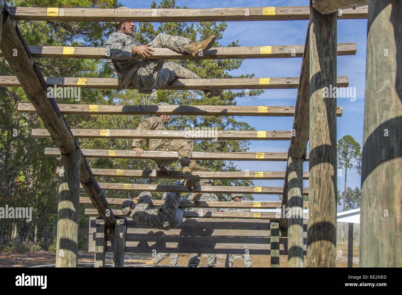Soldiers from 3rd Infantry Division weave through an obstacle as they ...
