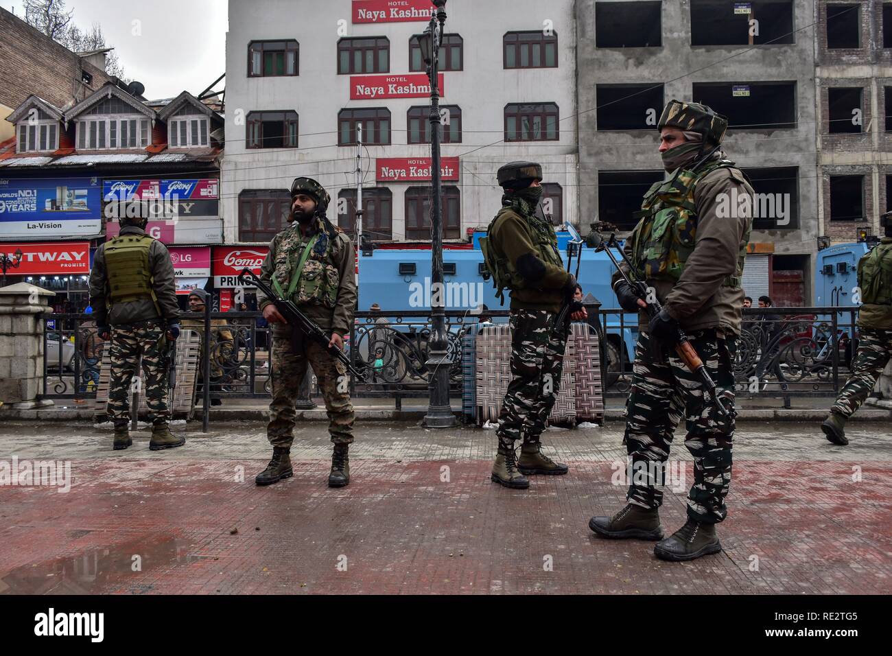 Srinagar, India. 19th Jan 2019. Paramilitary troopers seen standing ...