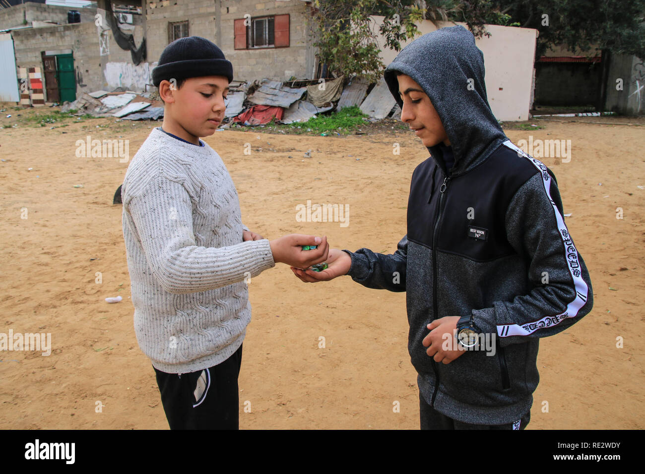 Children play the 'marbles', one of the most popular Palestinian game ...