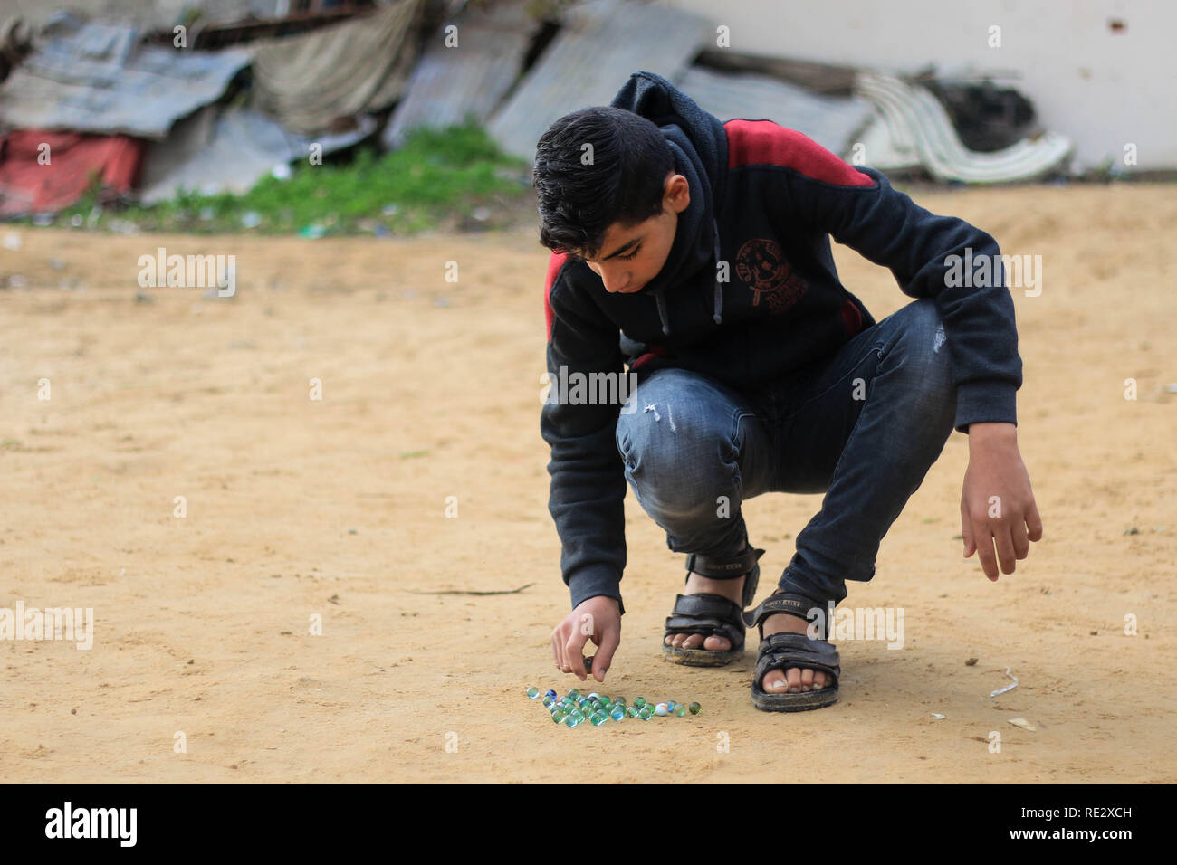 Gaza, Palestine. 18th Jan, 2019. A children seen placing his balls ...