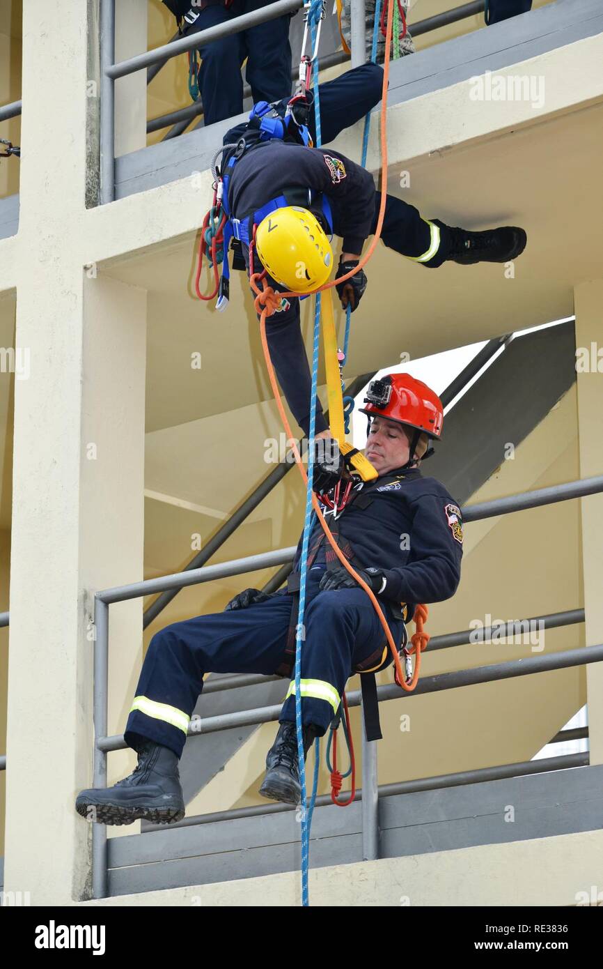 Firefighters Michele Santagiuliana and Damon Favor assigned to U.S ...