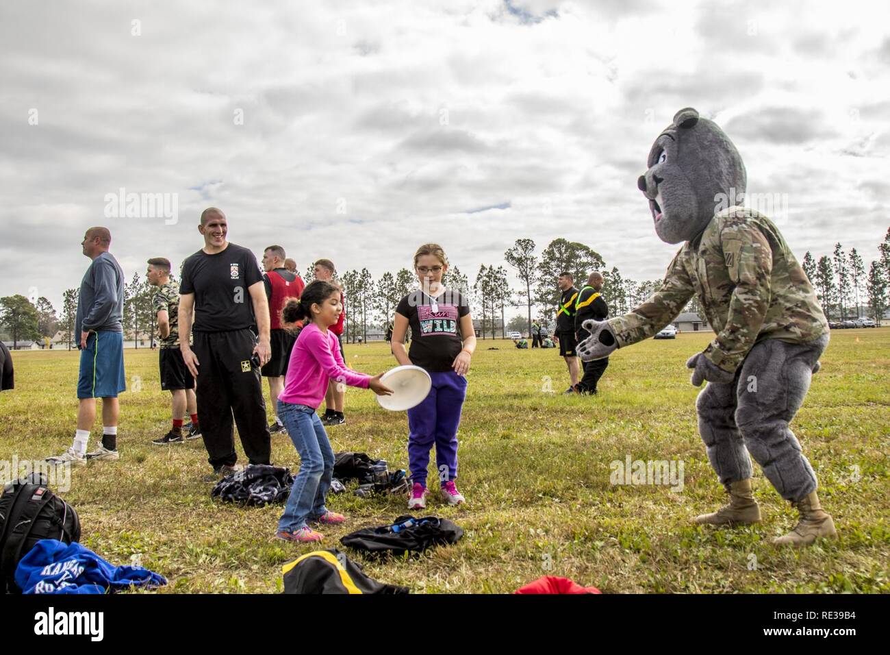Children play with Sgt. Rocky, the 3rd Infantry Division mascot during ...