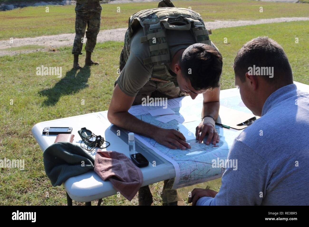 A Soldier maps out points at the Marne Mile Obstacle Course at Fort ...