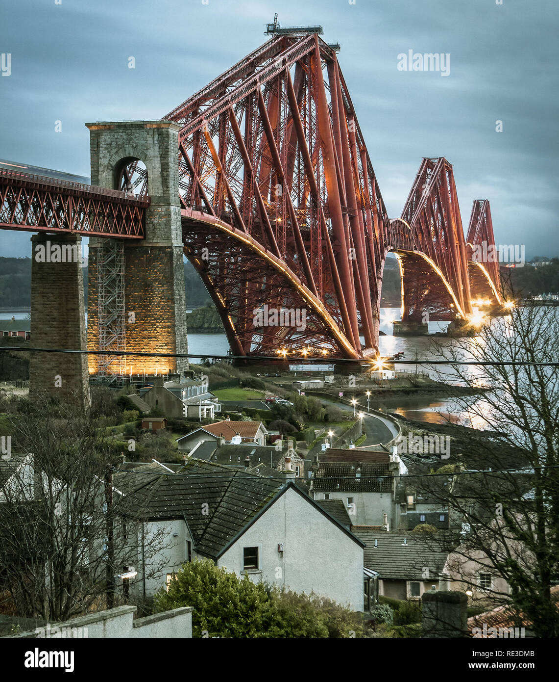 View of Forth Rail Bridge with lights on from the street.Iconic piece ...