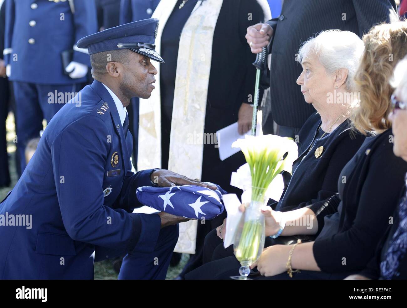 Rosalie Cassidy receives a folded flag from Gen. Darren McDew ...