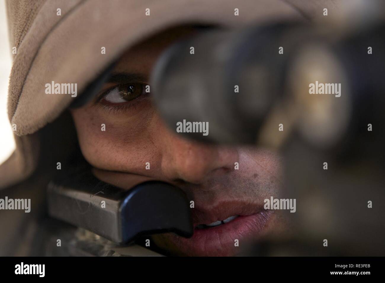 An Iraqi soldier takes aim with a T-5000 sniper rifle during stalking ...