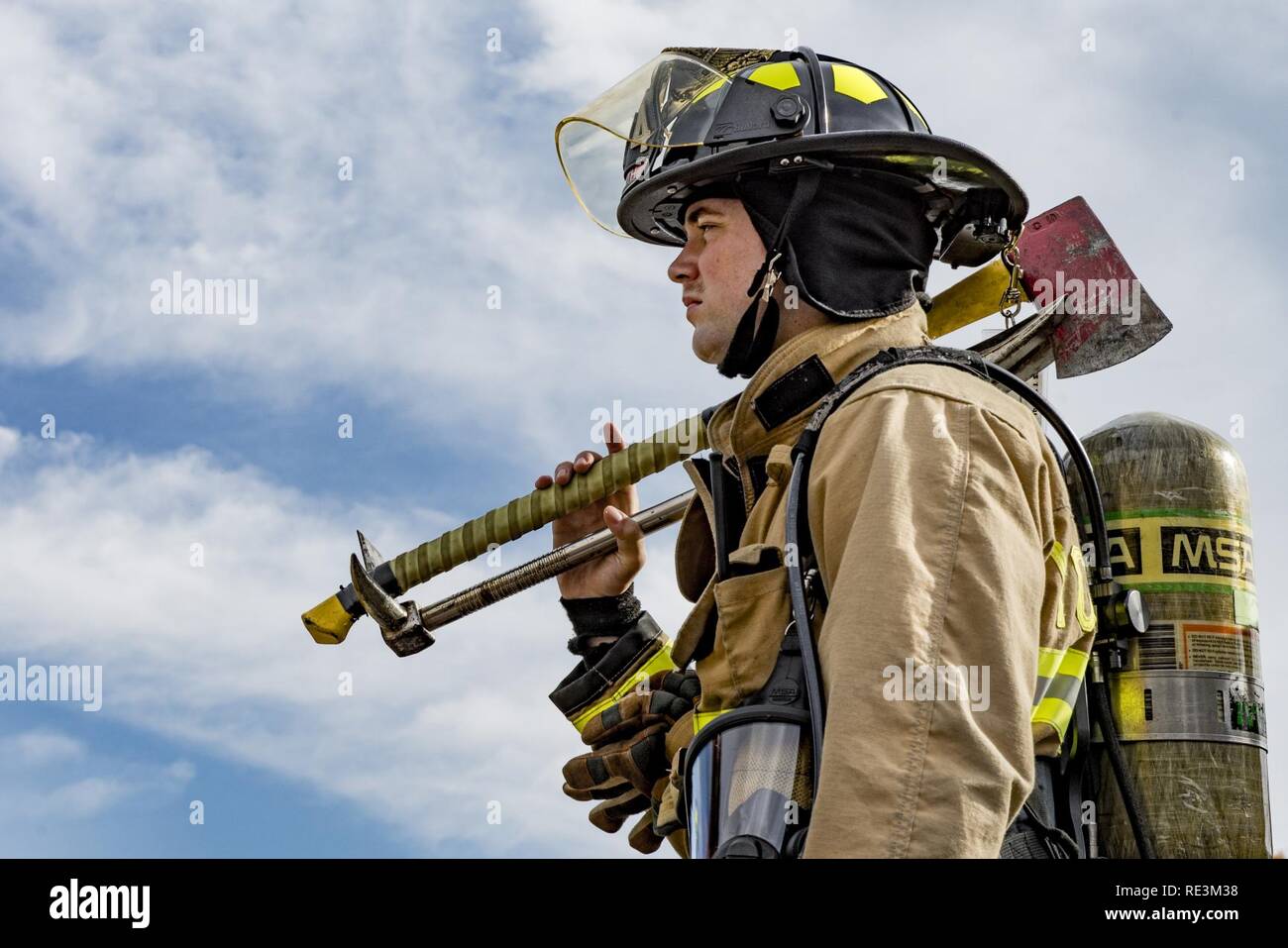 A firefighter from the 374th Civil Engineer Squadron waits to enter a ...