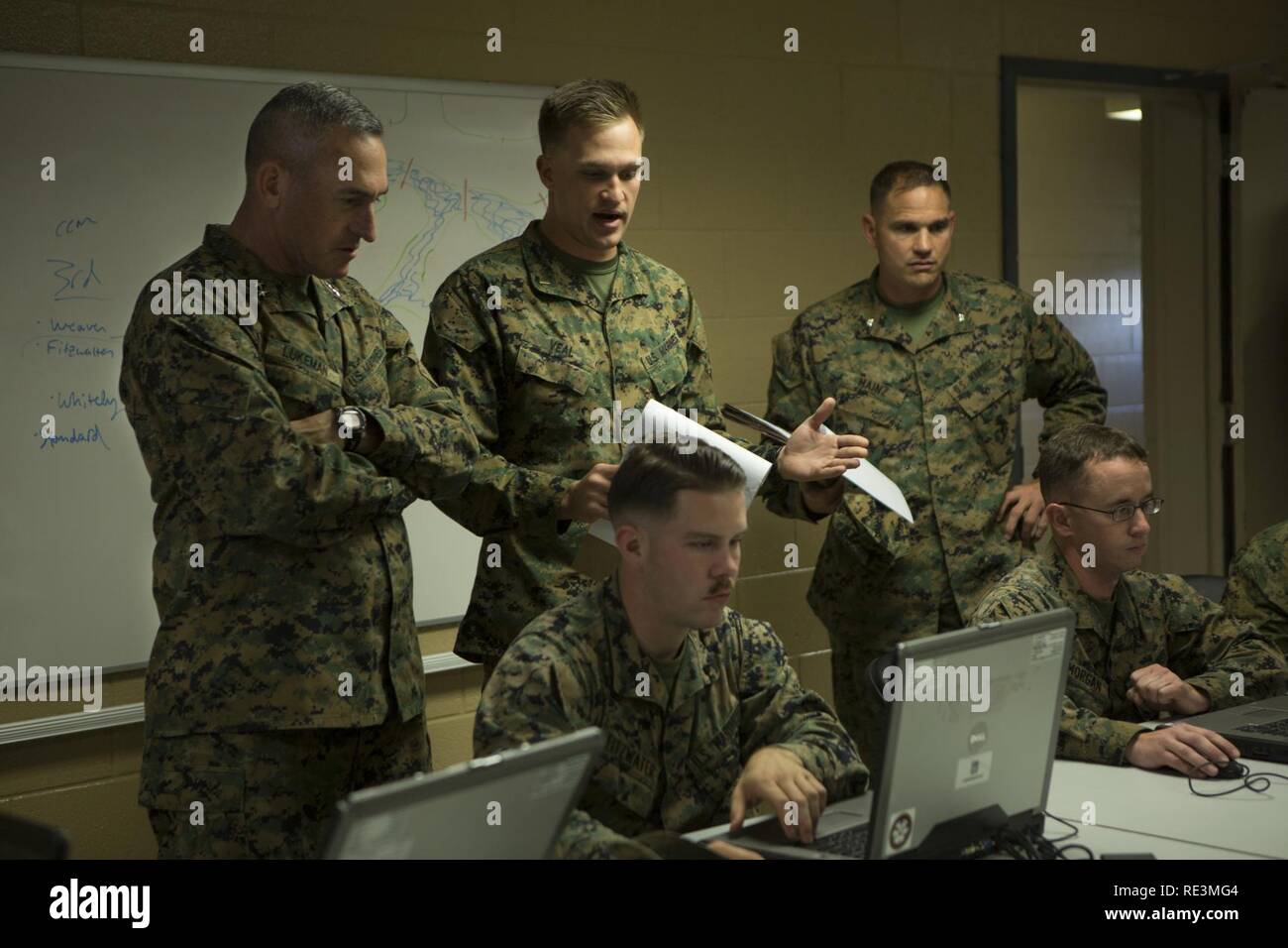 U.S. Marine Corps 2nd Lt. Andrew W. Veal, center, infantry officer, 2nd ...