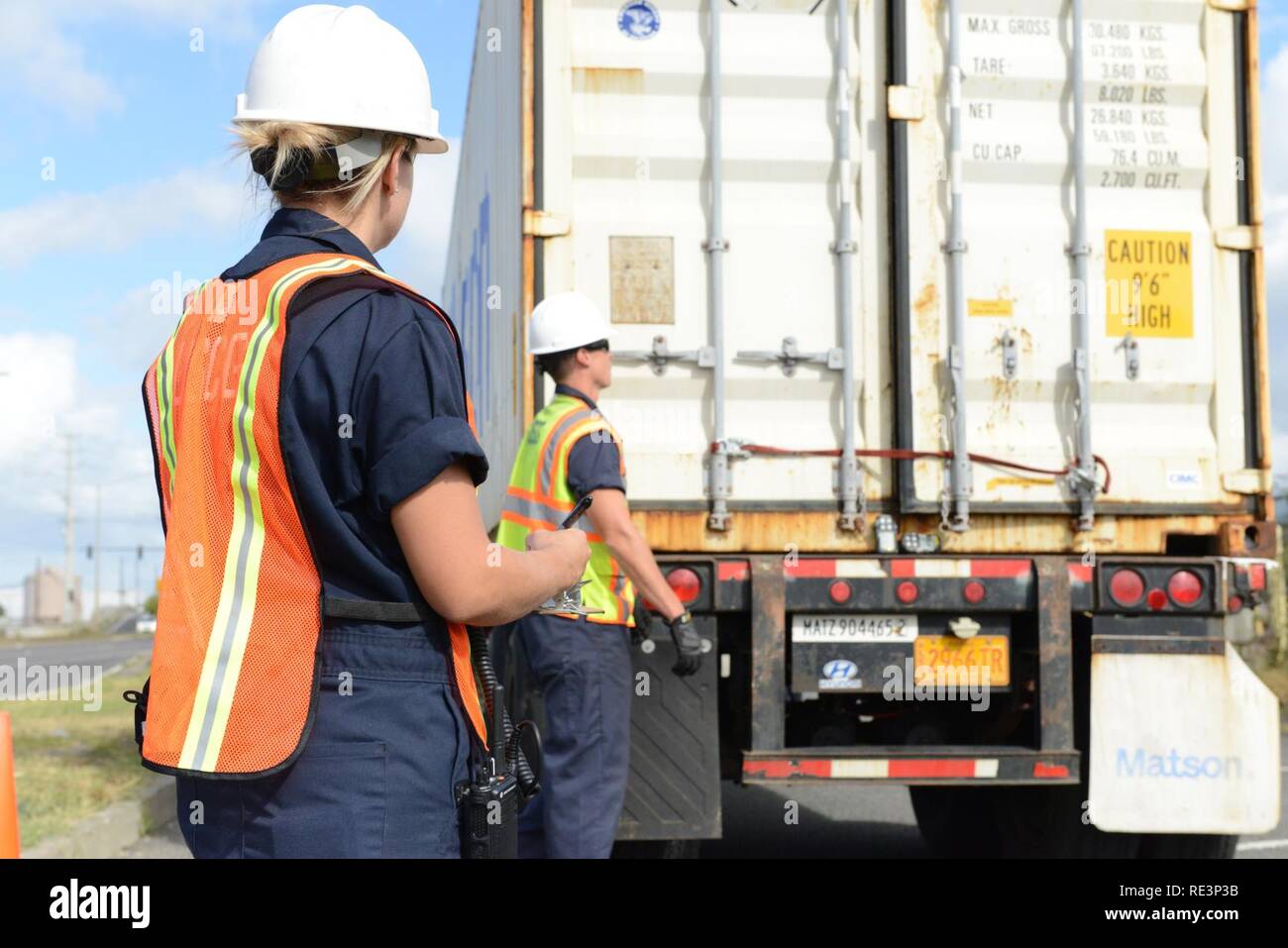 Crewmembers from Coast Guard Sector Honolulu inspect containers at the ...