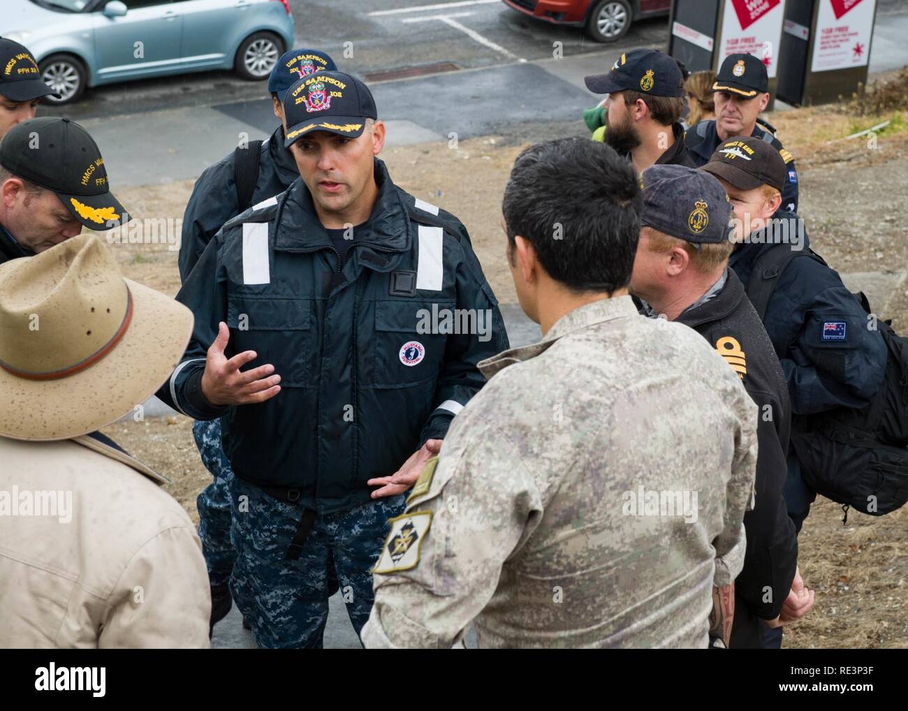 Cmdr. Timothy LaBenz, middle, commanding officer of Arleigh Burke-class ...