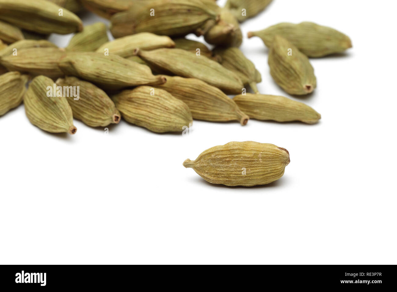 Dry cardamom pods isolated on white background Stock Photo - Alamy