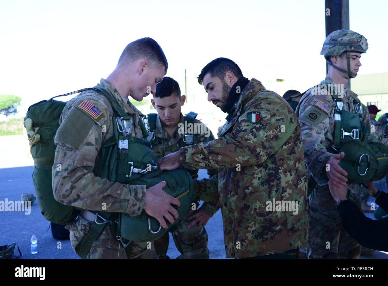 An Italian Army Folgore Brigade soldier inspects the equipment of an U ...