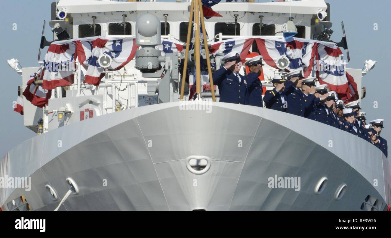 Members of the Coast Guard Cutter Rollin Fritch man the rail and ...