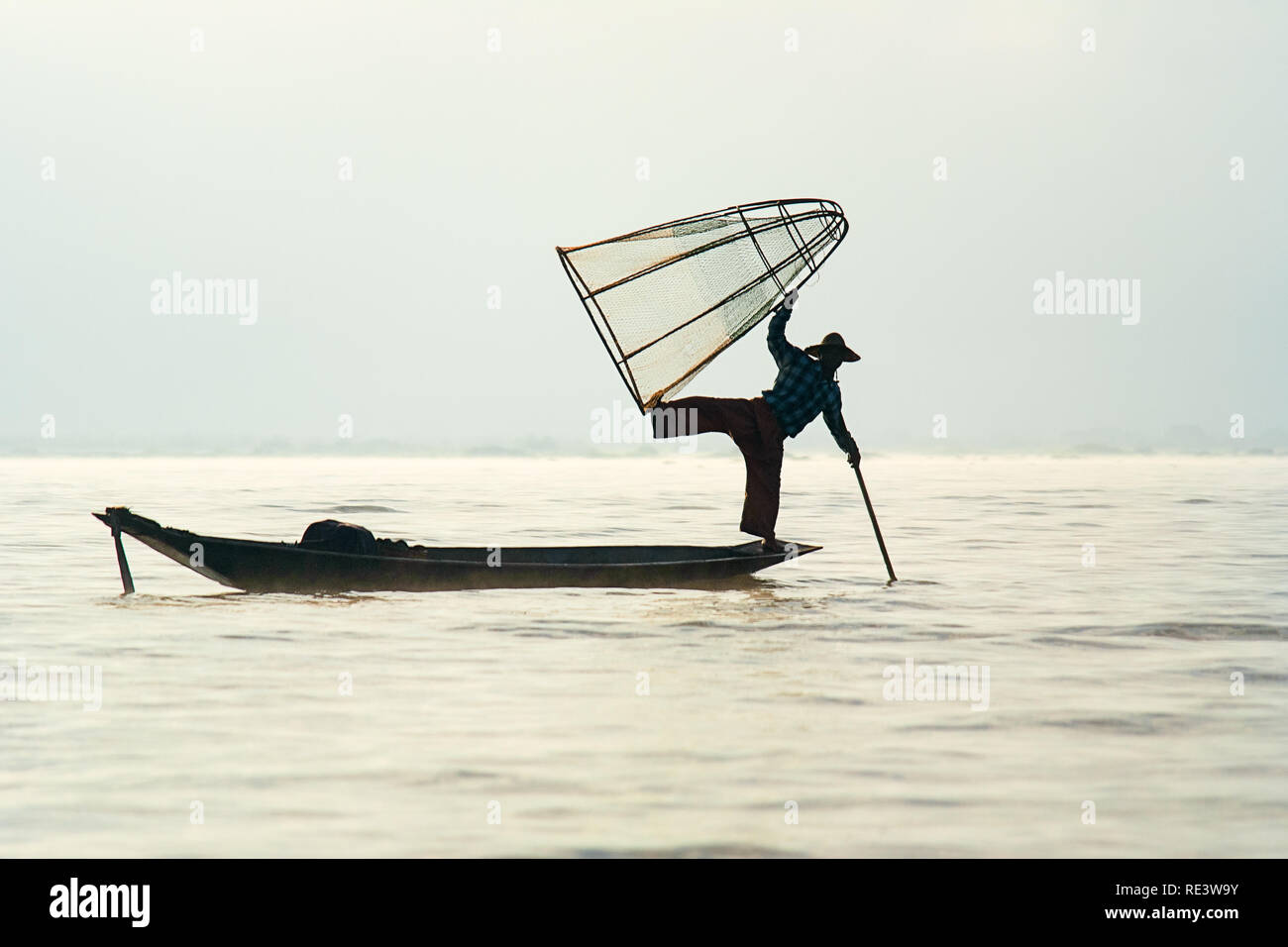Intha fisherman of Inle Lake, fishing in their traditional style in the ...