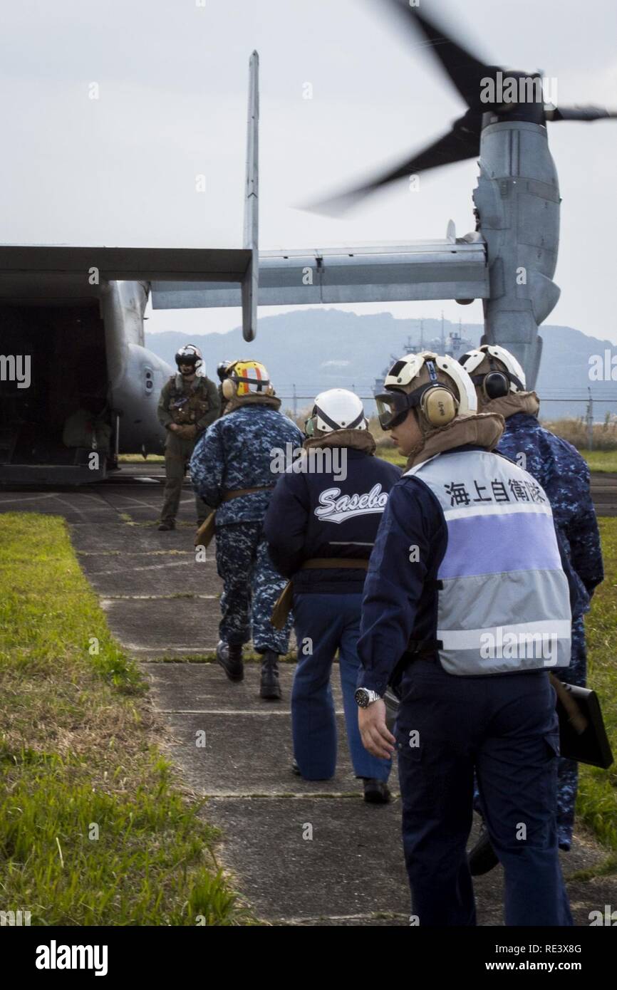 Navy Capt. Ed Thomson, commander of Amphibious Squadron 11; Mr. Norio ...
